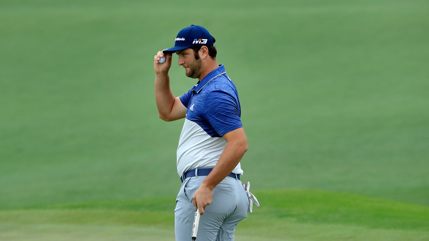 Jon Rahm tips his cap to the patrons after making birdie on hole No. 2 ...