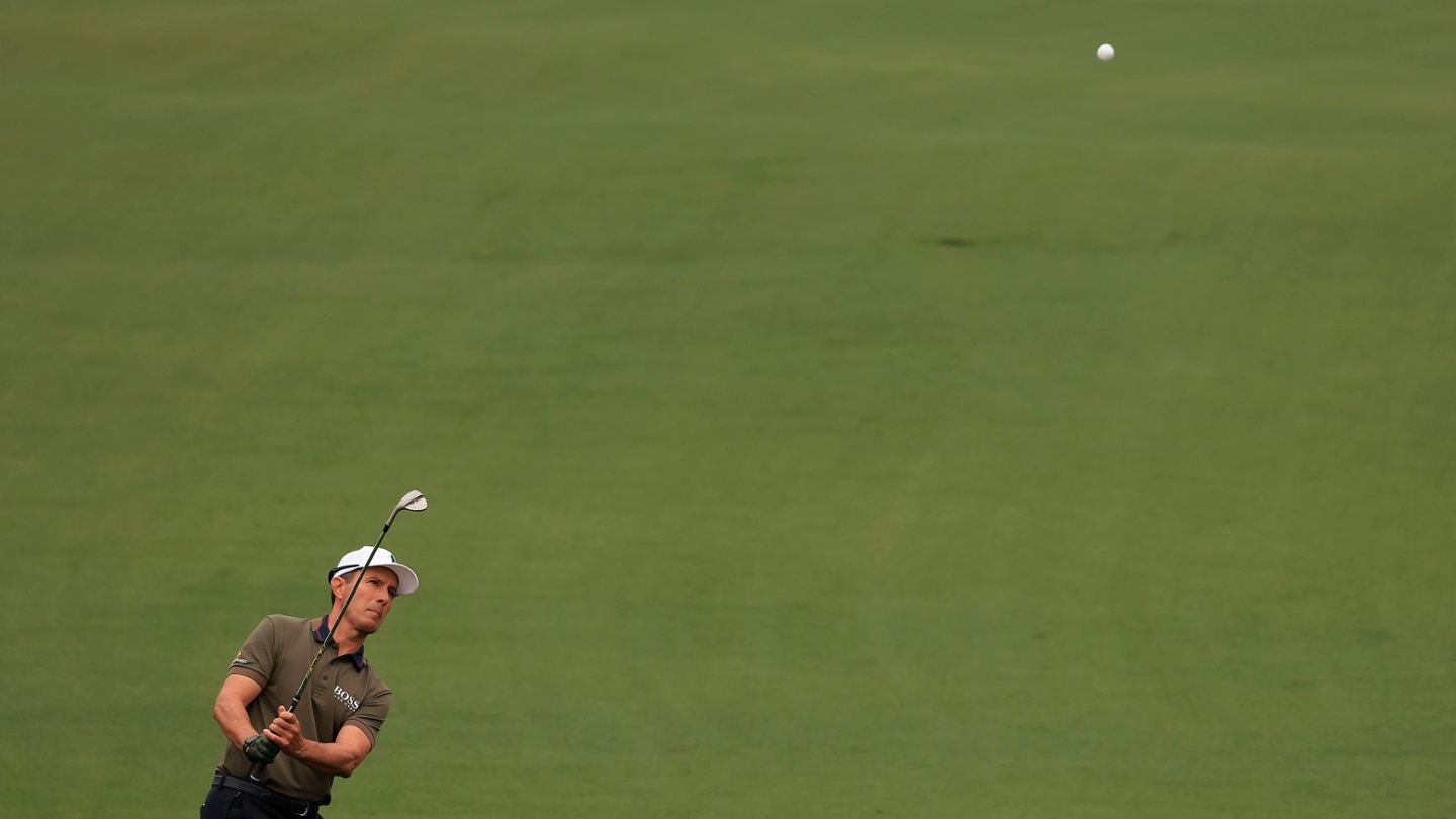Masters champion Mike Weir of Canada chips to the No. 2 green during ...
