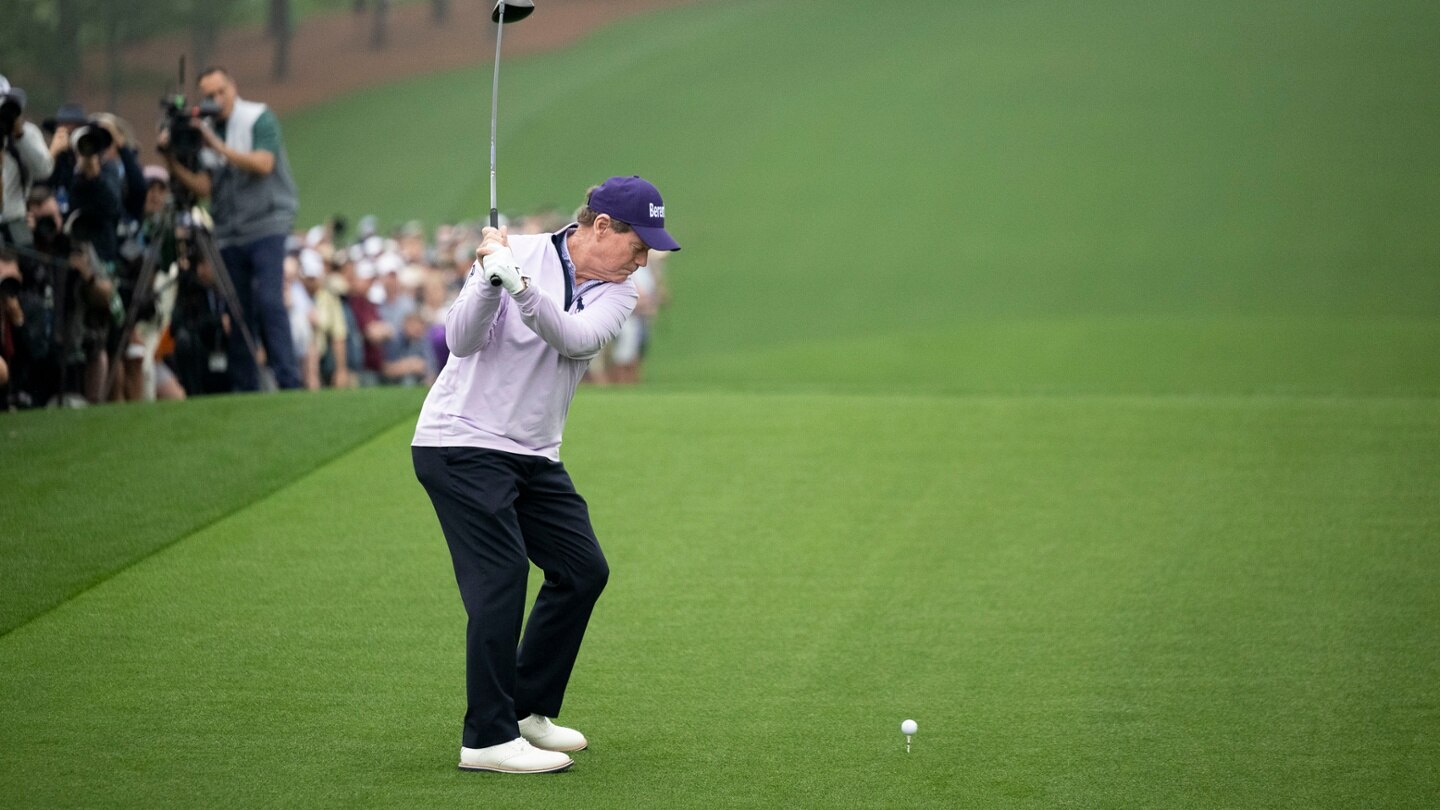 Masters champion and Honorary Starter Tom Watson hits his tee shot ...