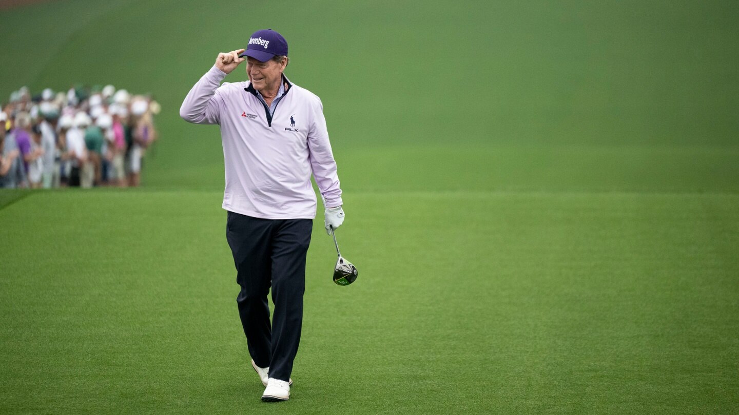 Masters champion and Honorary Starter Tom Watson tips his cap to the ...