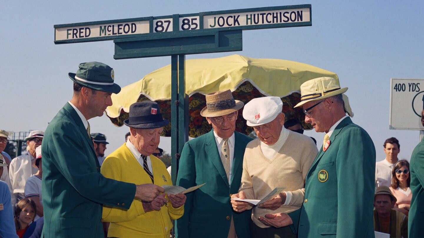 Honorary Starters Jock Hutchison and Fred McLeod looked over scorecards ...