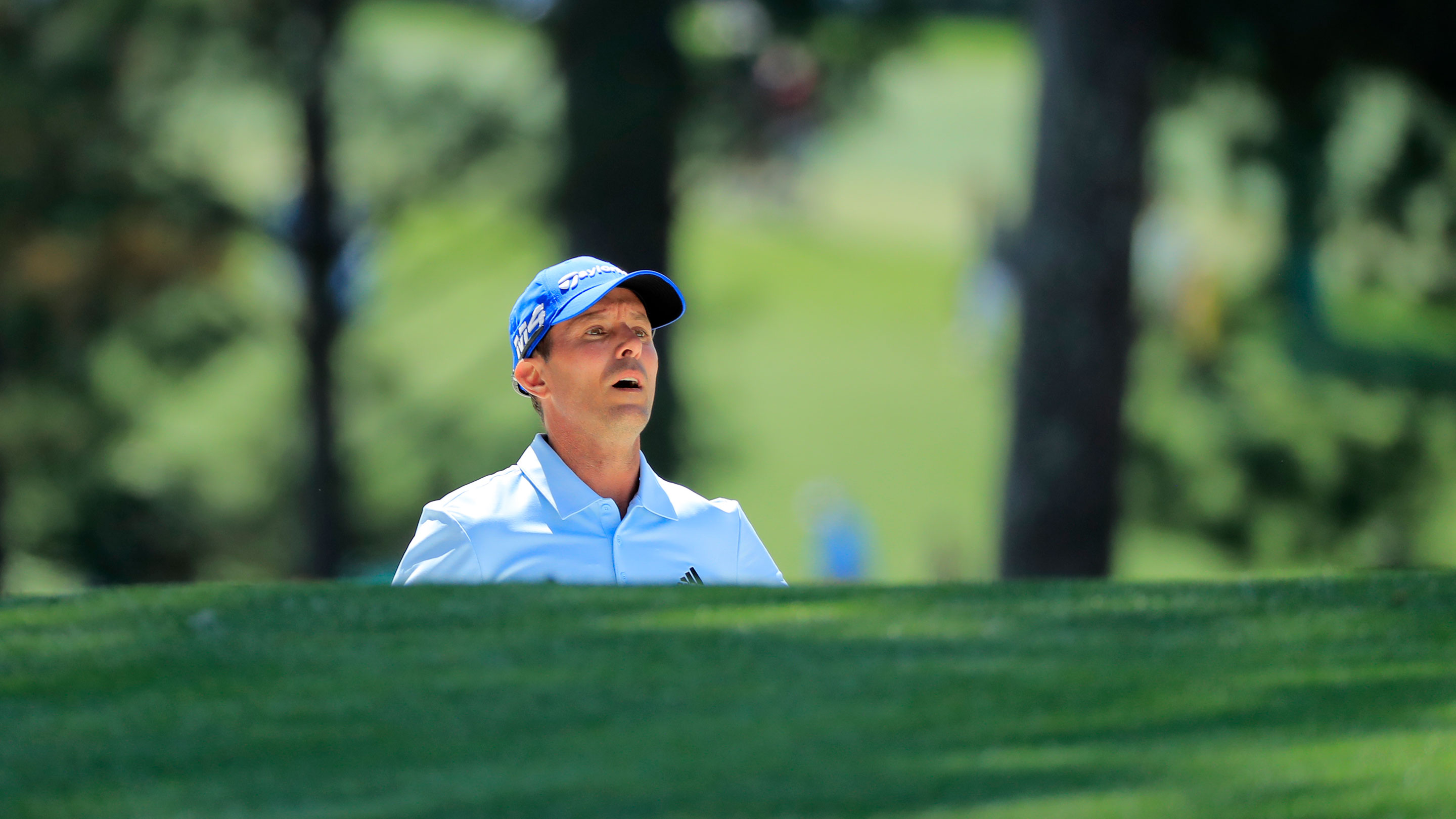 Masters champion Mike Weir of Canada jumps to read his shot from the ...
