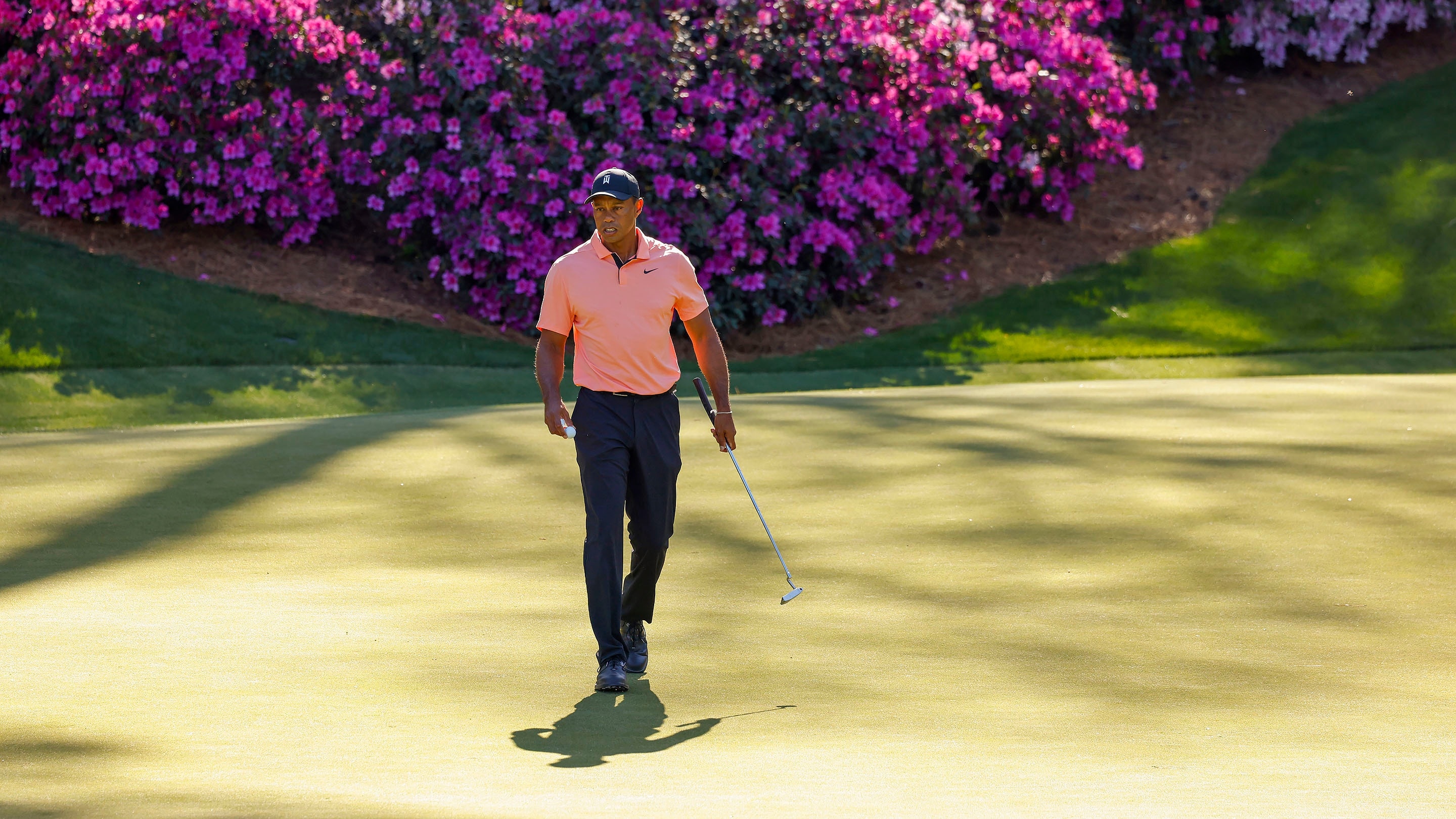 Masters champion Tiger Woods stands on the No. 13 green during a ...
