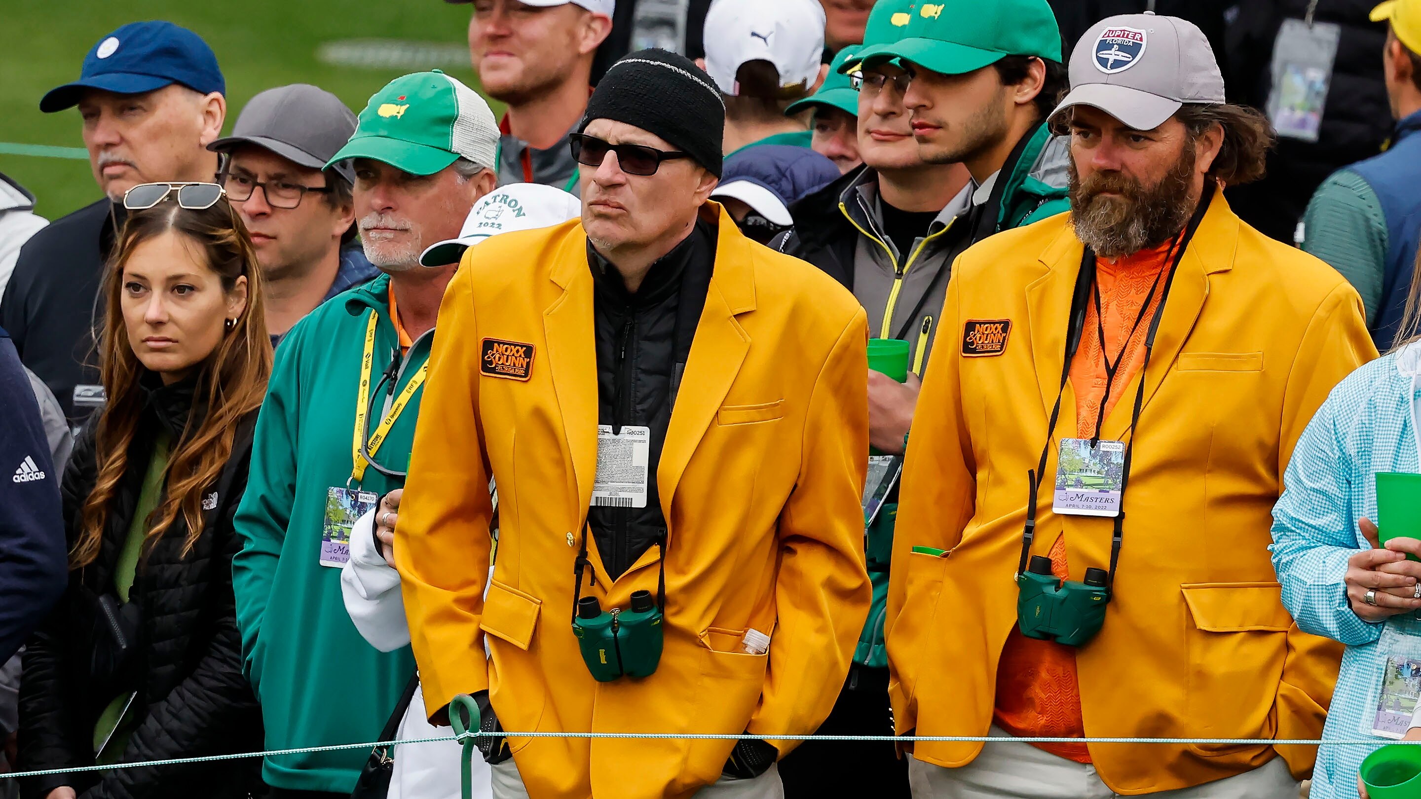Two patrons wear orange blazers on the No. 1 hole during the third ...