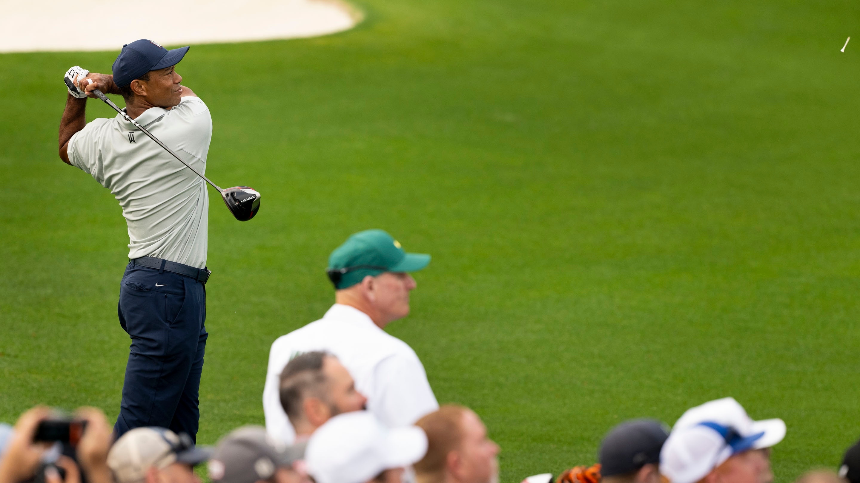 Masters champion Tiger Woods of the United States plays a stroke from ...
