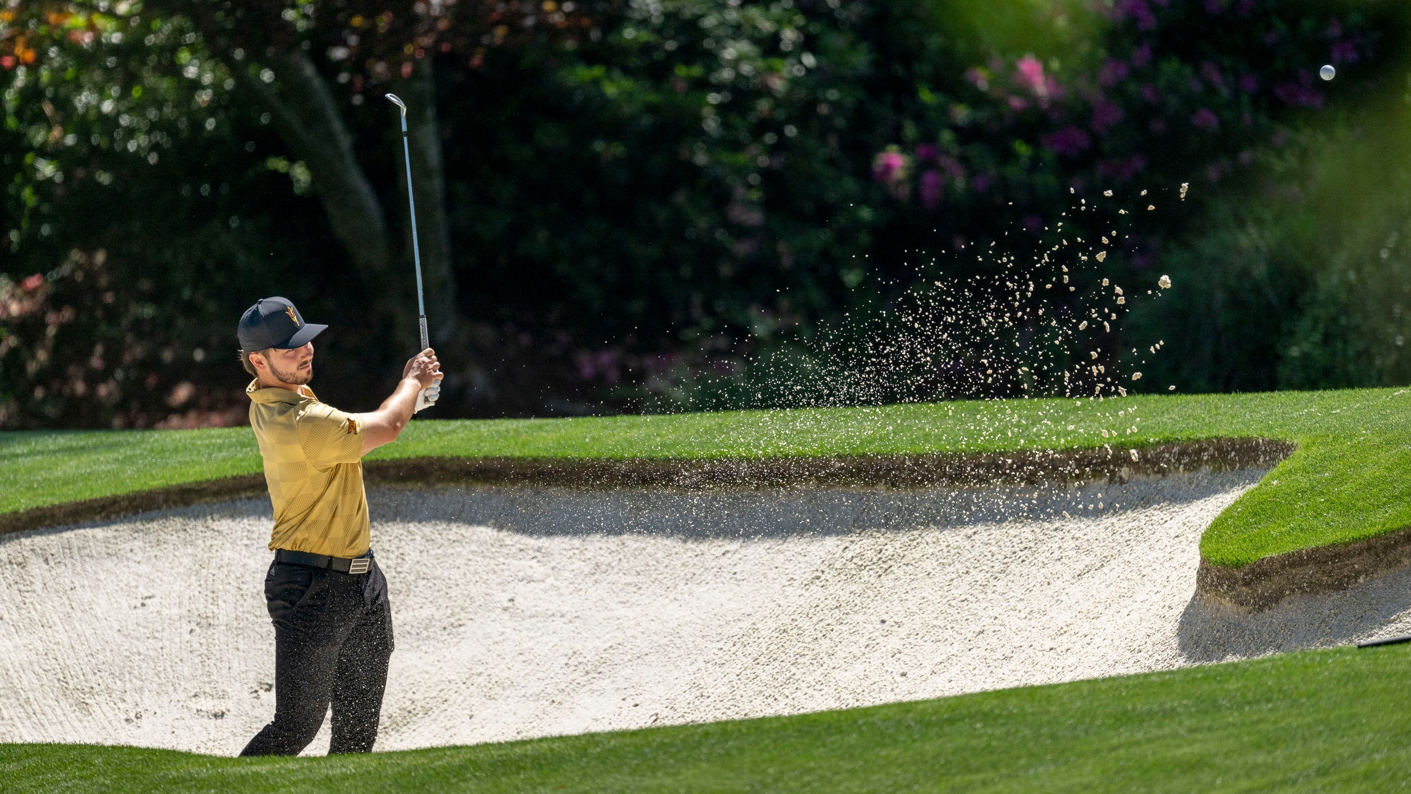 Amateur Jose Luis Ballester of Spain plays a stroke from a bunker on ...